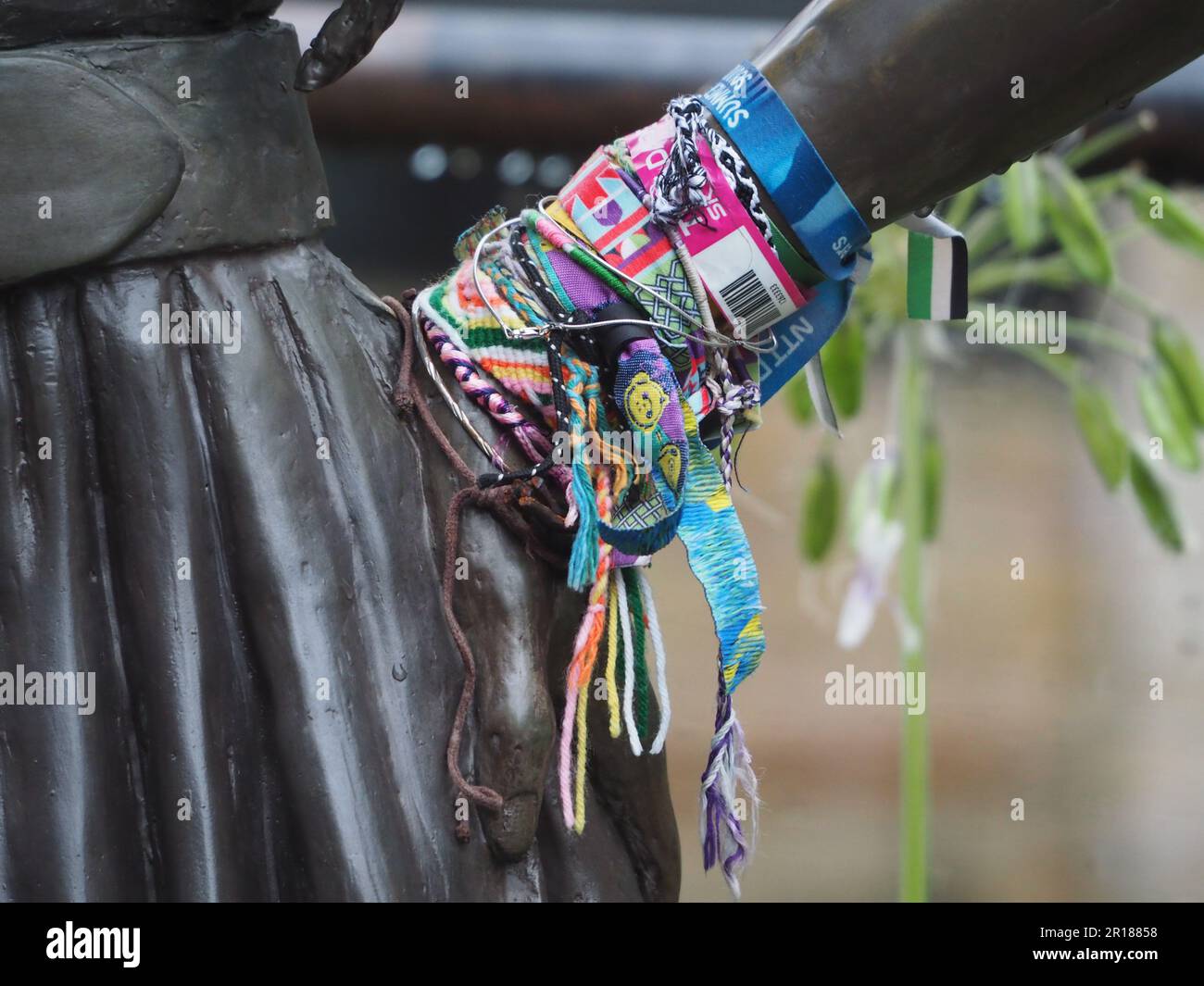 A close-up of the statue of Amy Winehouse wearing multiple decorative ...