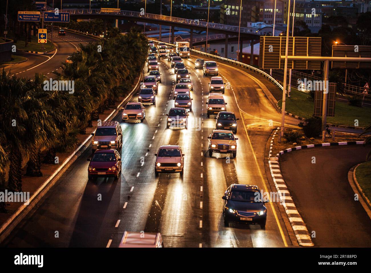Traffic jam, highway and street in night for driving, transportation or ...