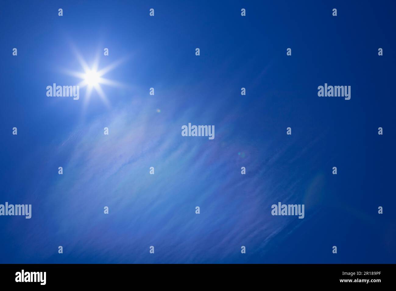 Iridescent clouds and the Sun Stock Photo - Alamy