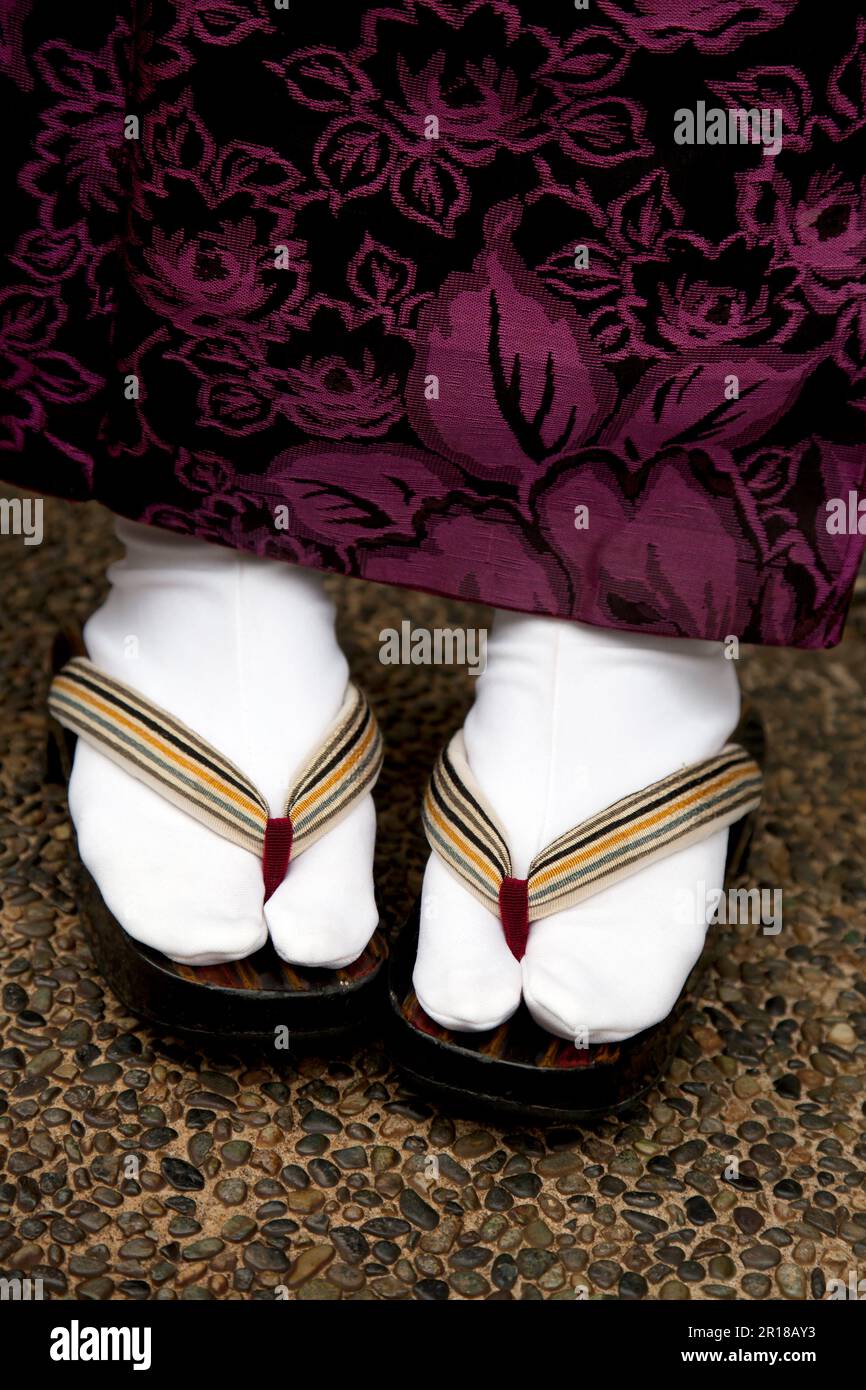 Geta and tabi of woman wearing kimono Stock Photo - Alamy