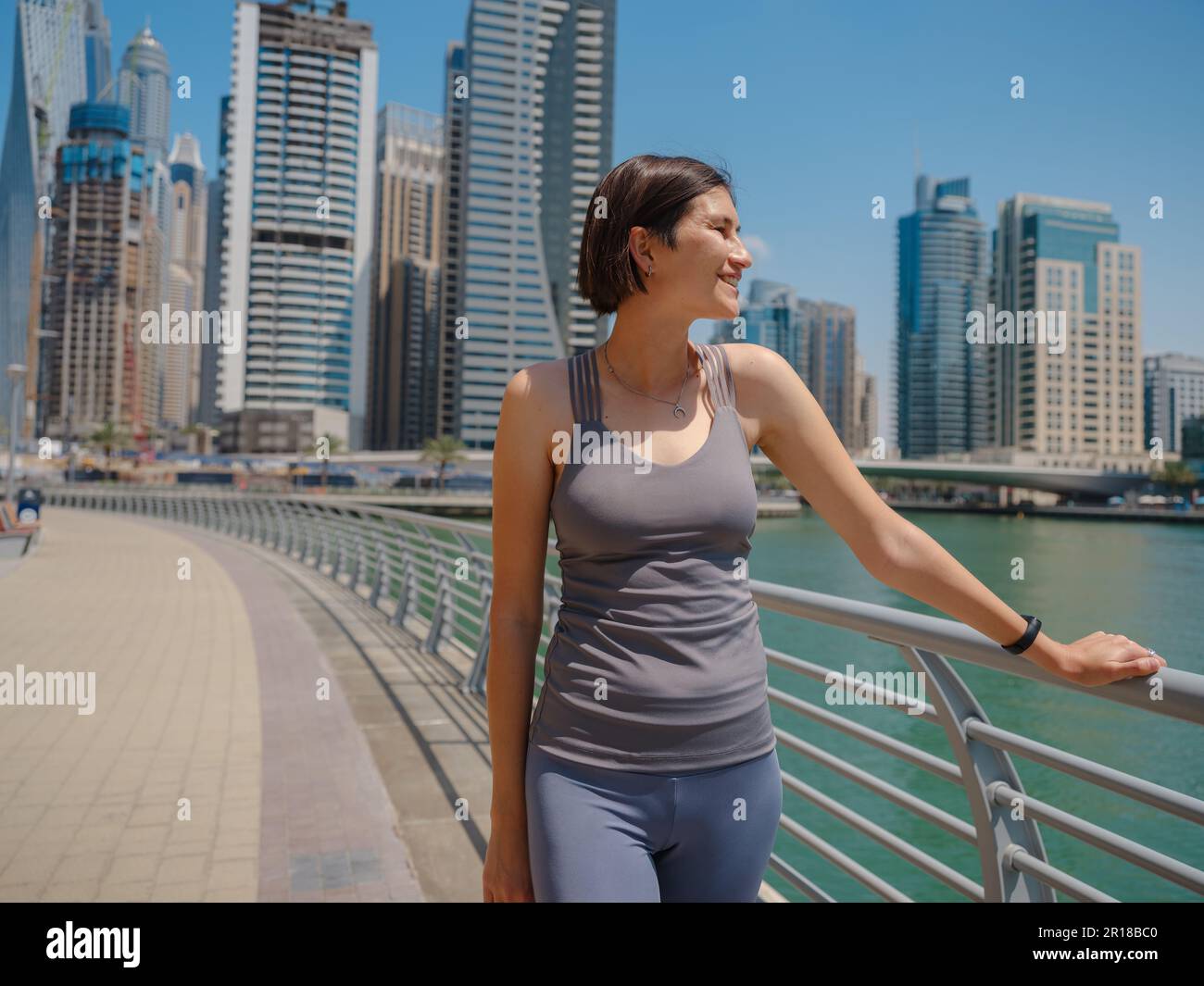 City Running - asian woman runner , Dubai marina urban scene in ...