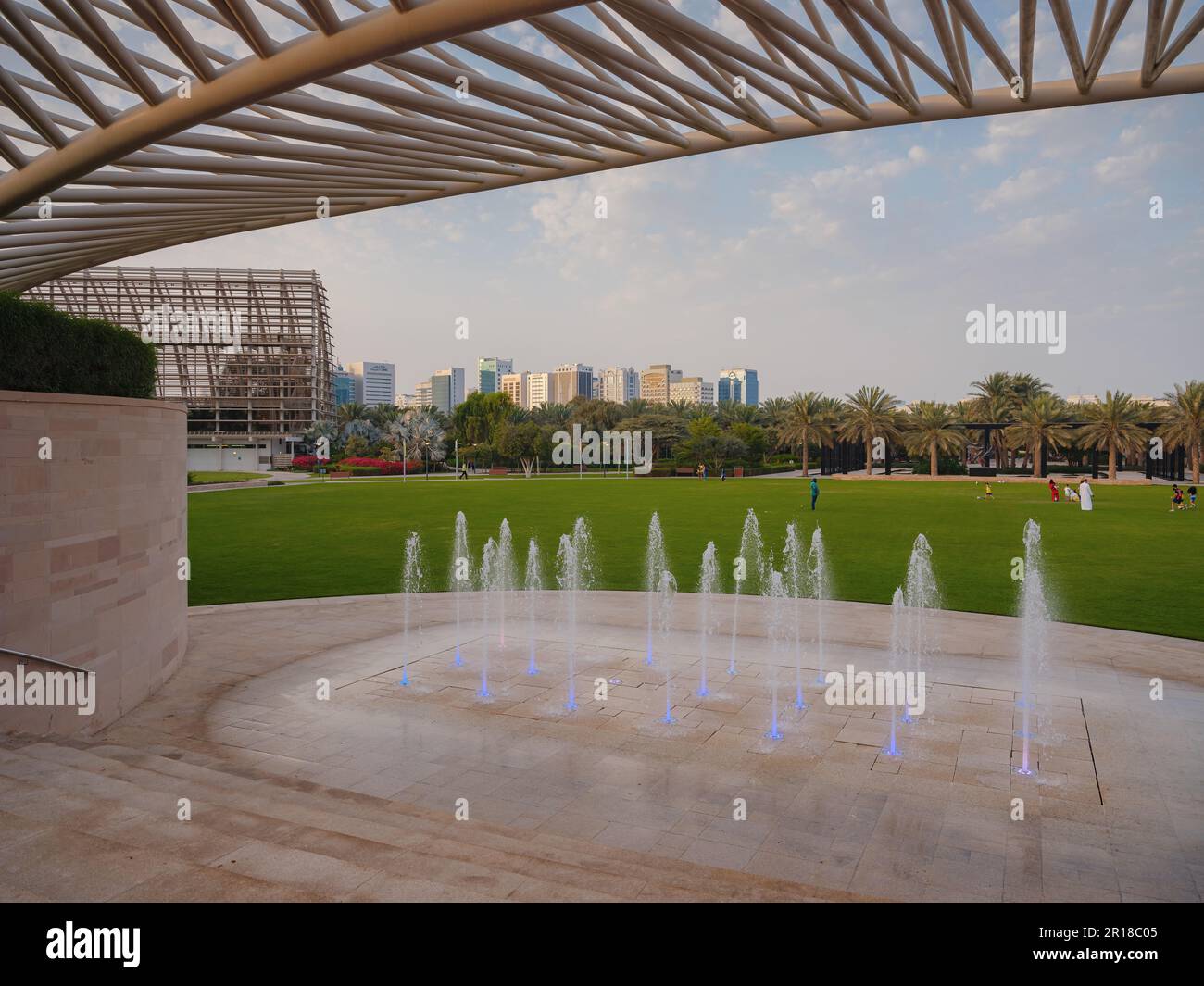 Large green evening park in the big city, Umm Al Emarat Park in Abu ...