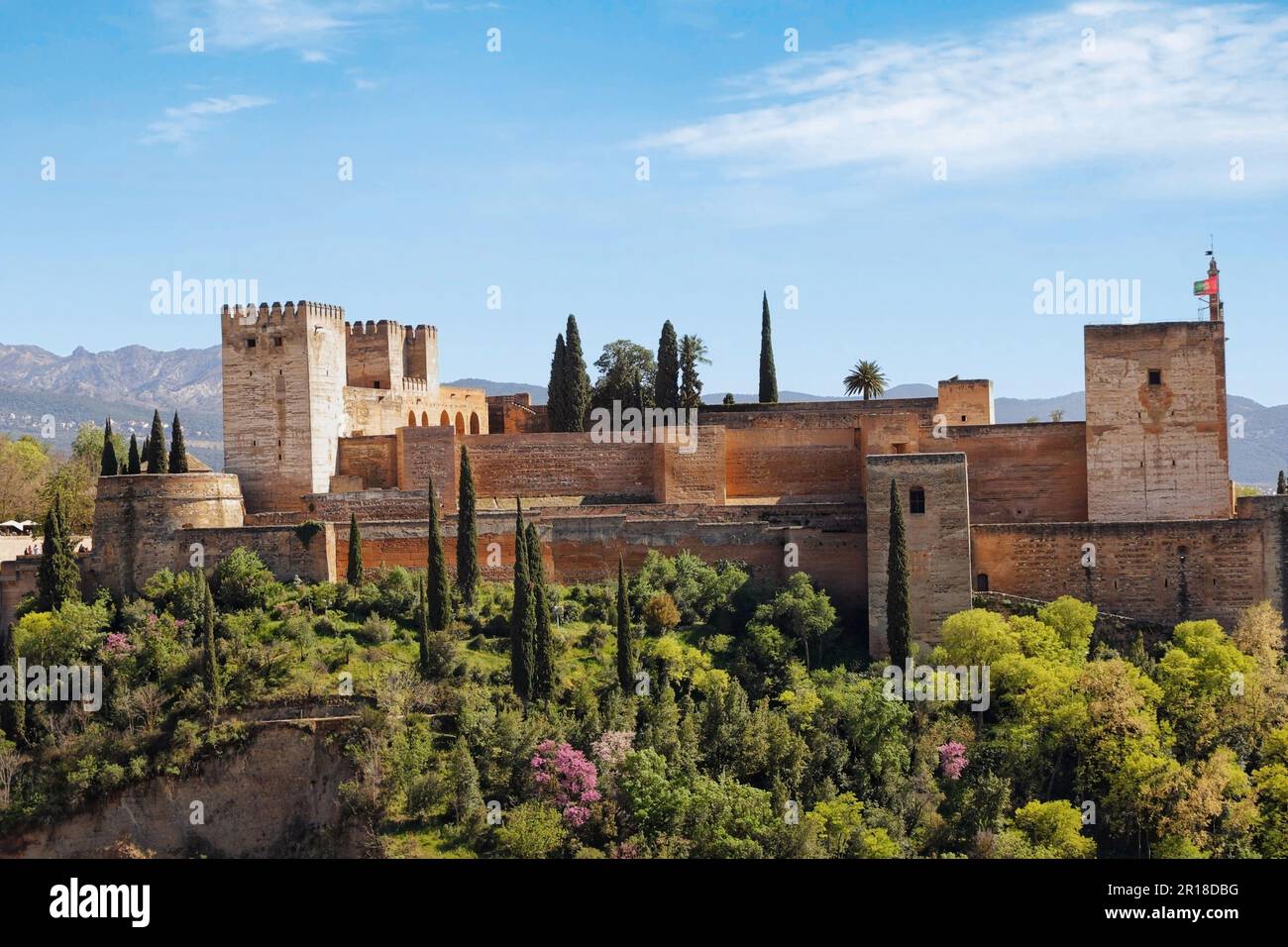 The majestic Alhambra castle towers over a lush forest landscape Stock ...