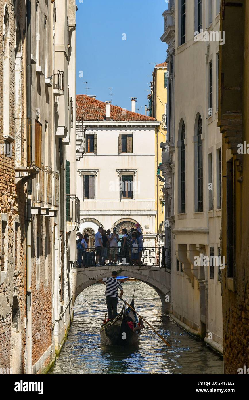 Gondola on the Rio de San Salvador narrow canal with the Ponte Manin ...