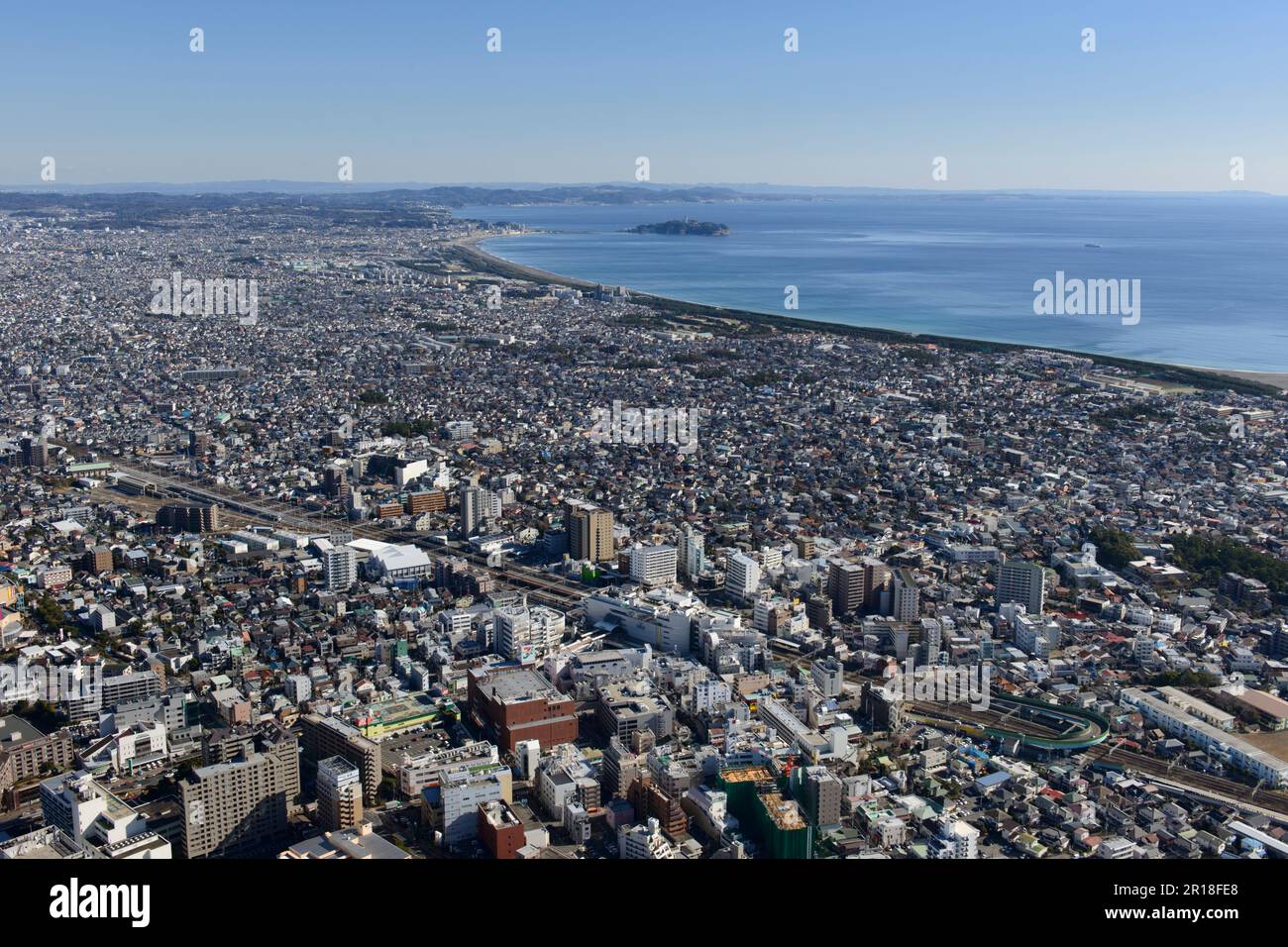 Aerial shot of Chigasaki station overlooking Sagami Bay, Enoshima ...