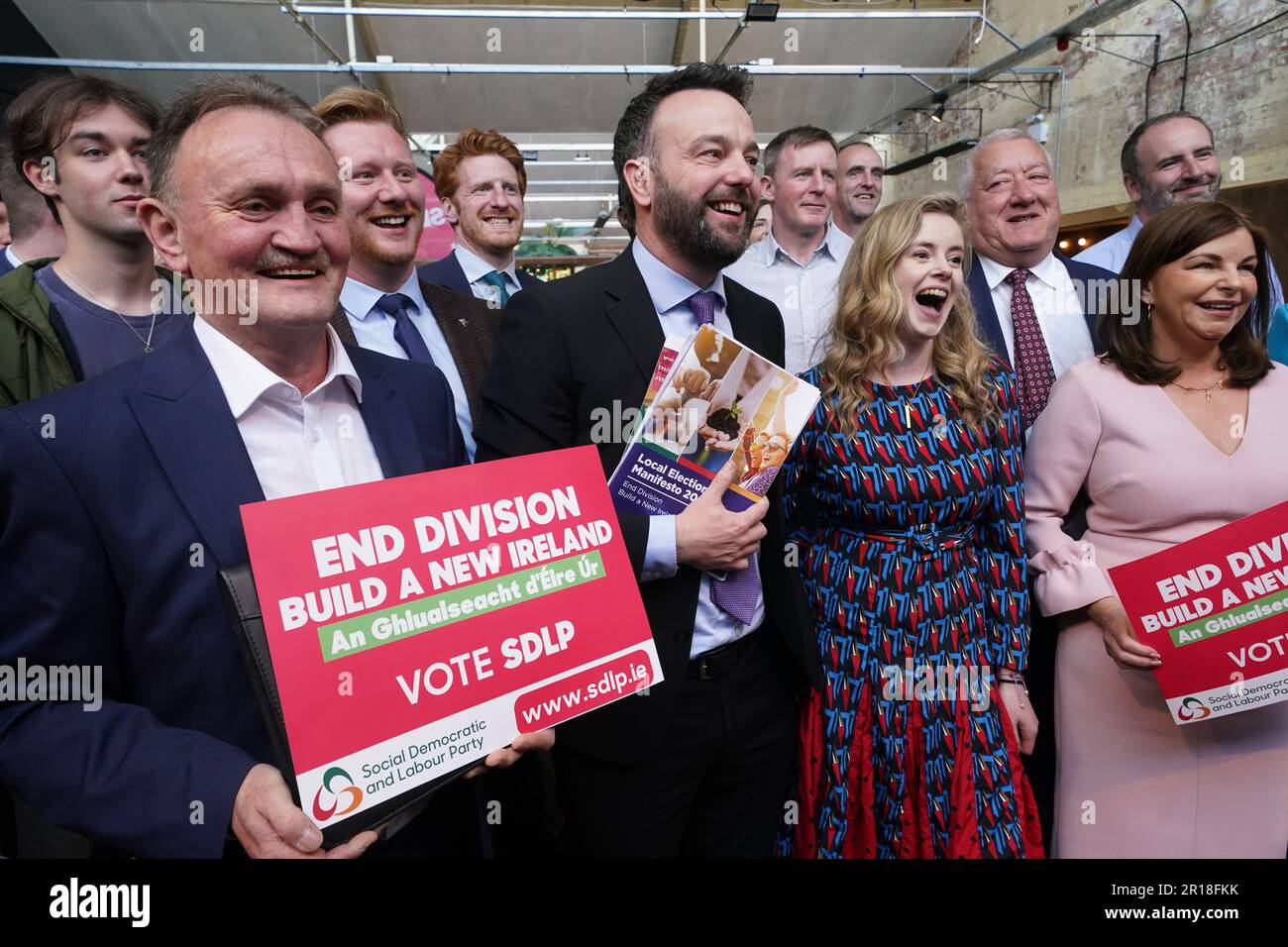 SDLP leader Colum Eastwood (centre) with Newry council election ...