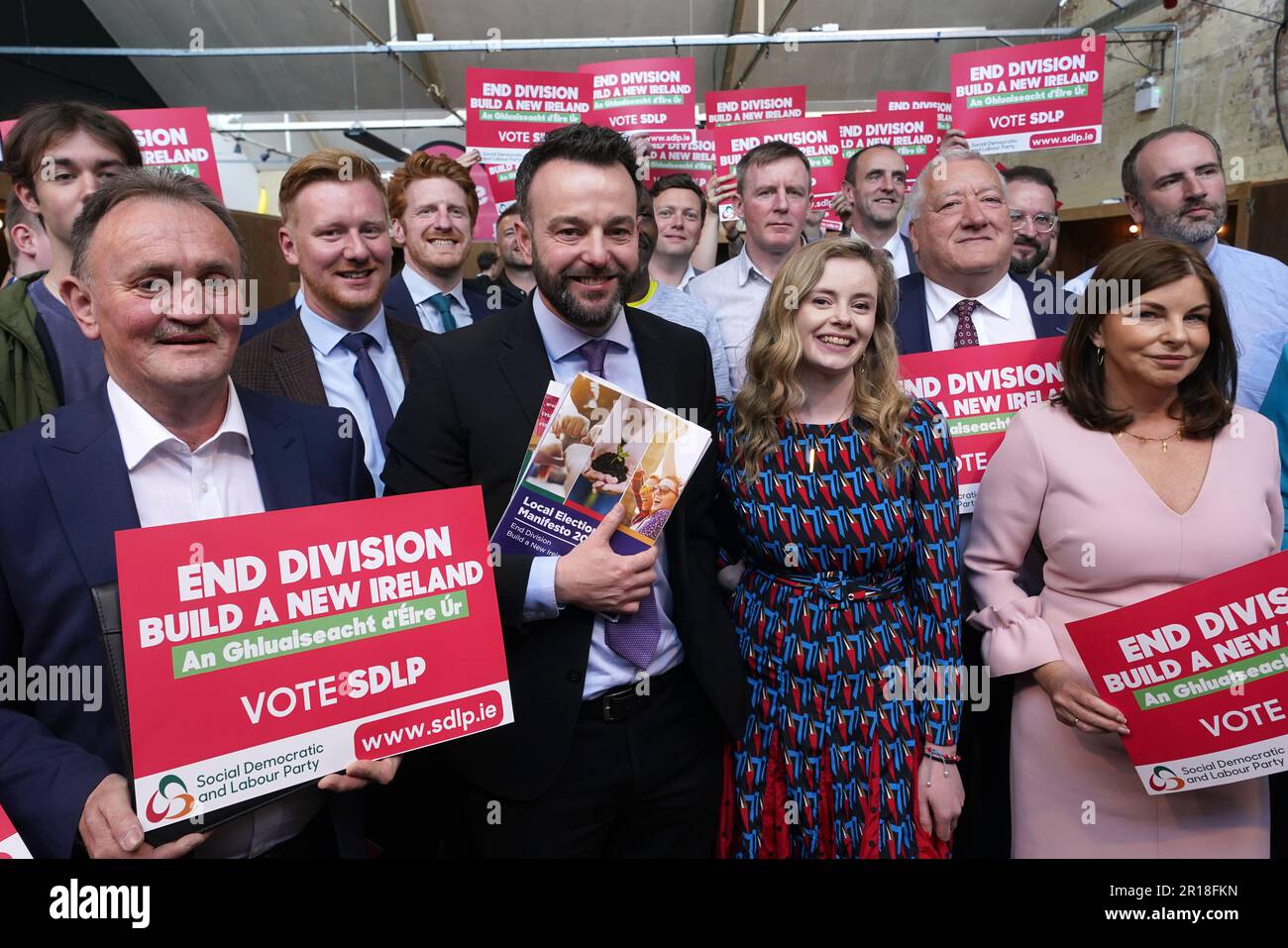 SDLP leader Colum Eastwood (centre) with Newry council election ...