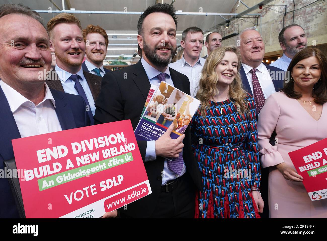 SDLP leader Colum Eastwood (centre) with Newry council election ...