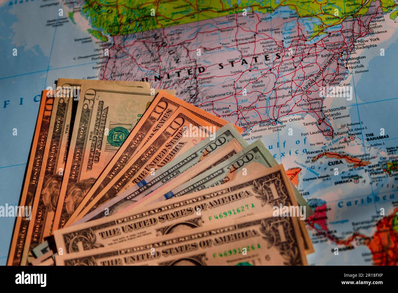 a map of the USA with banknotes arranged underneath. The concept of ...
