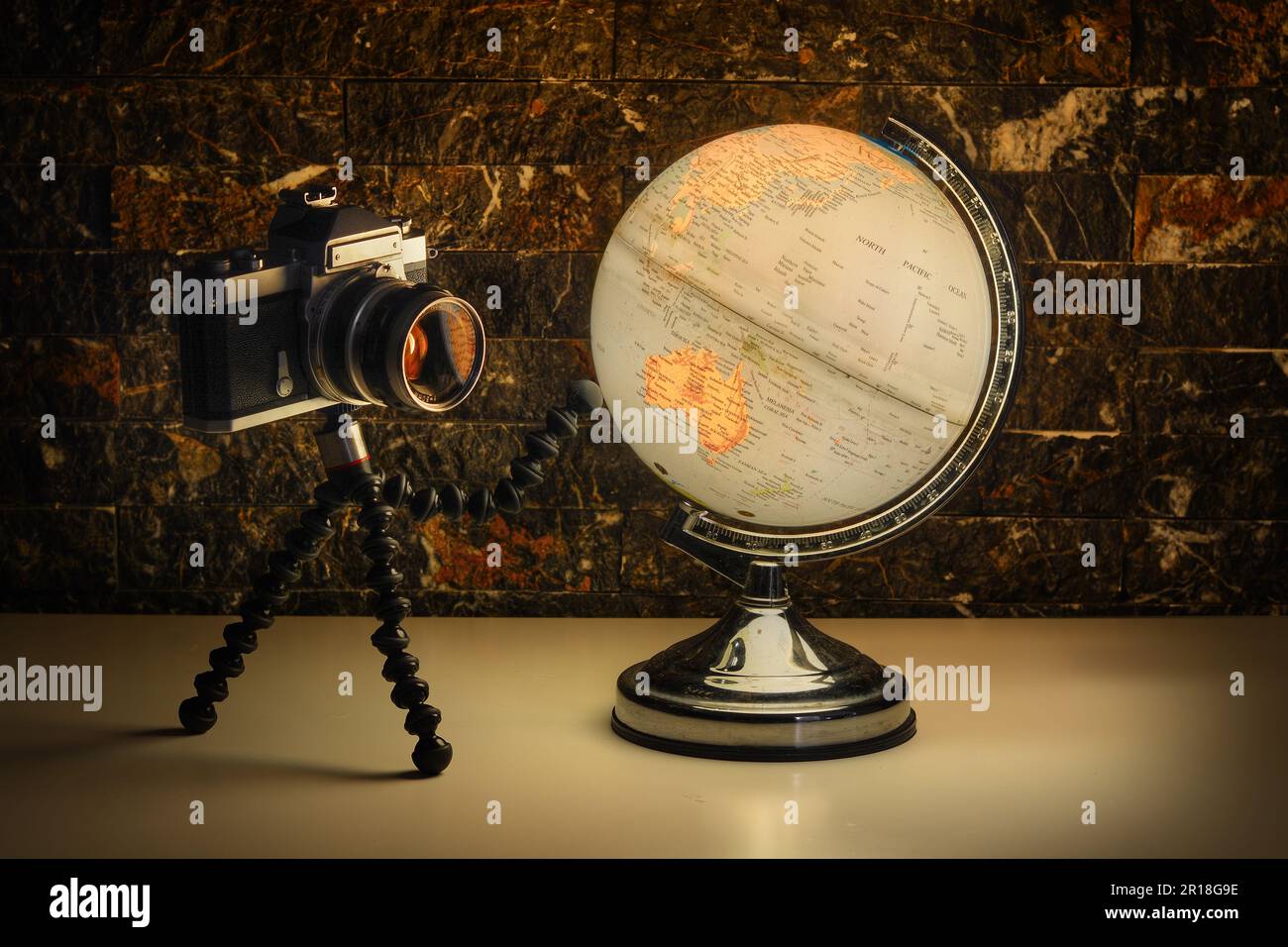 A photo of an old film camera looking at decorative World Traveler ...