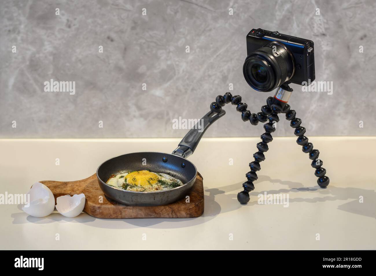 A photo of a digital camera cocking Fried egg Stock Photo - Alamy