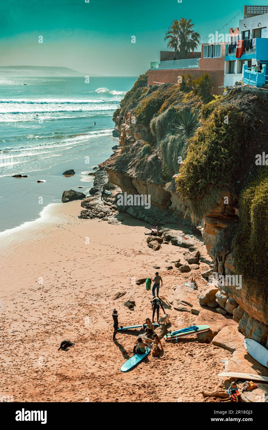 A group of people are enjoying a sunny day at the beach in Morocco ...