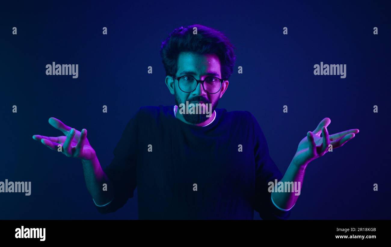 Studio dark blue neon background Indian man Arabian male model guy ...