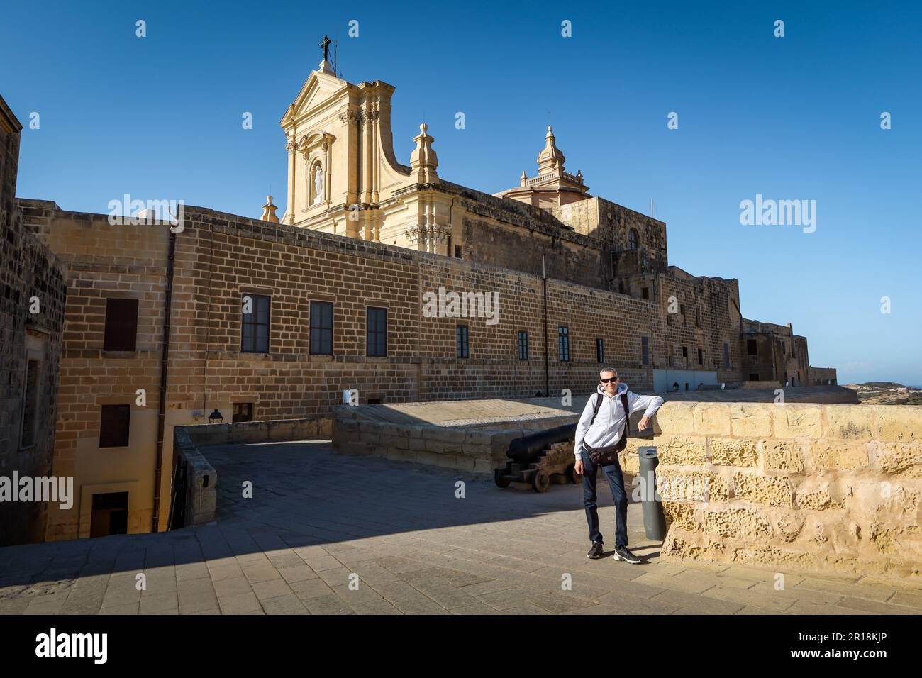 Rabat, Gozo, Malta - April 18, 2023: Man posing for photo in front of a ...