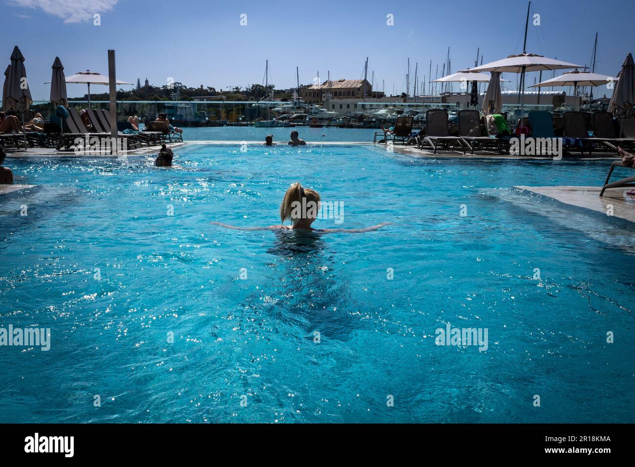 Valetta, Malta - April 17, 2023: Woman relaxing in the infinity ...