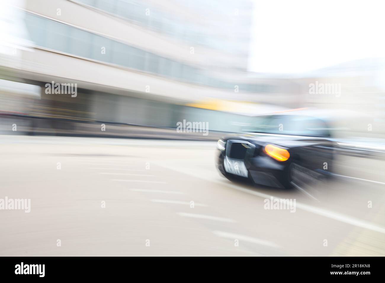 London Black Cab passing by in the city centre, shot using long ...