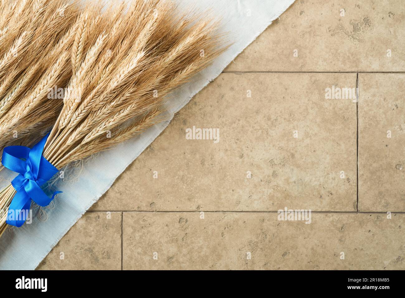Shavuot jewish holiday celebration. Bouquet of golden ripe wheat with ...