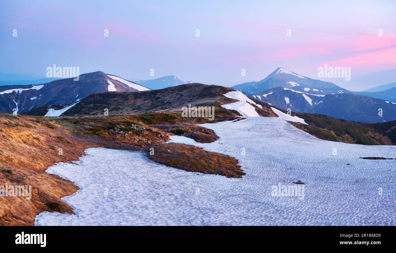 Spring mountains panorama during stunning sunrise with pink sky ...