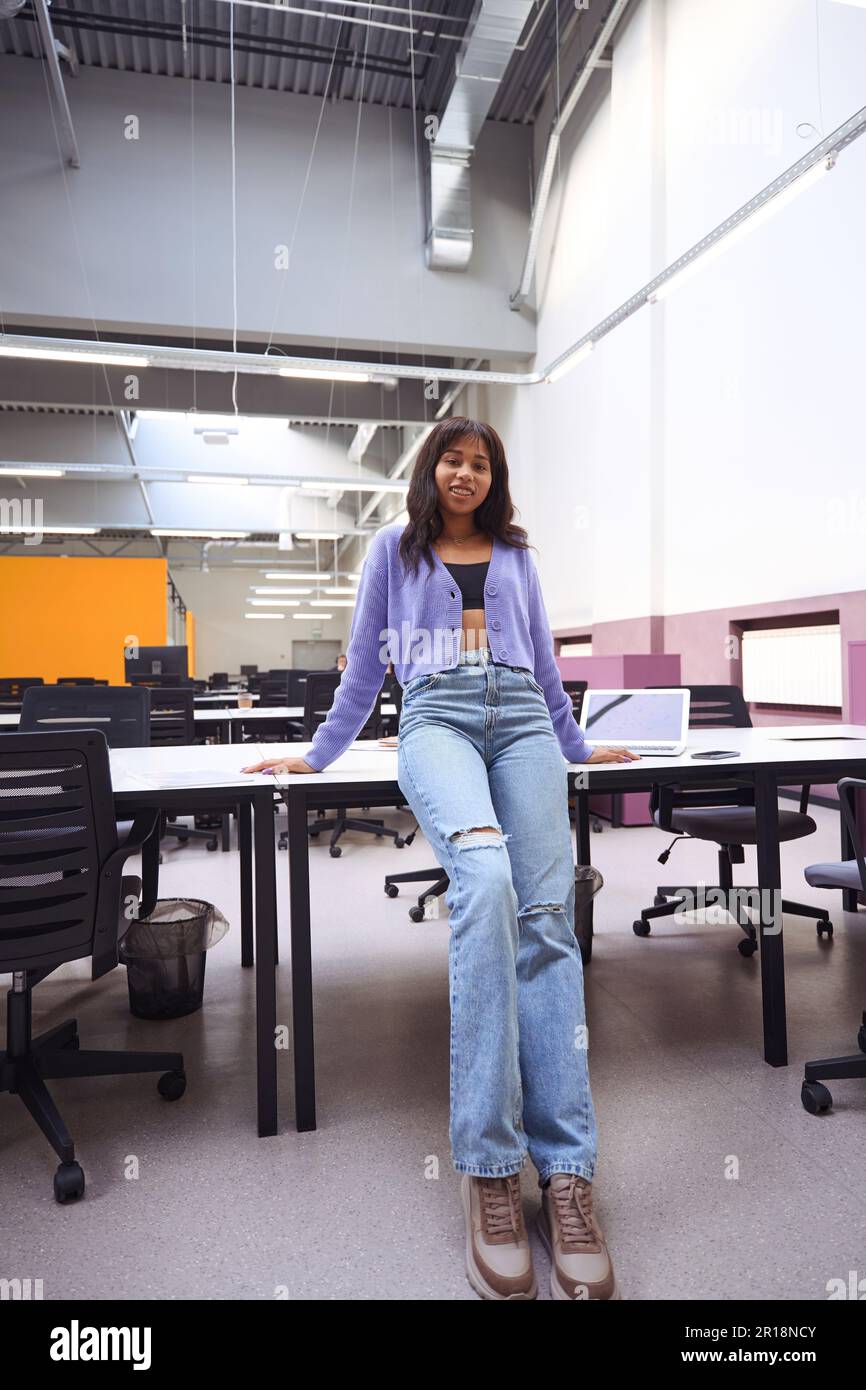 Beautiful female worker posing at camera in open space office Stock ...