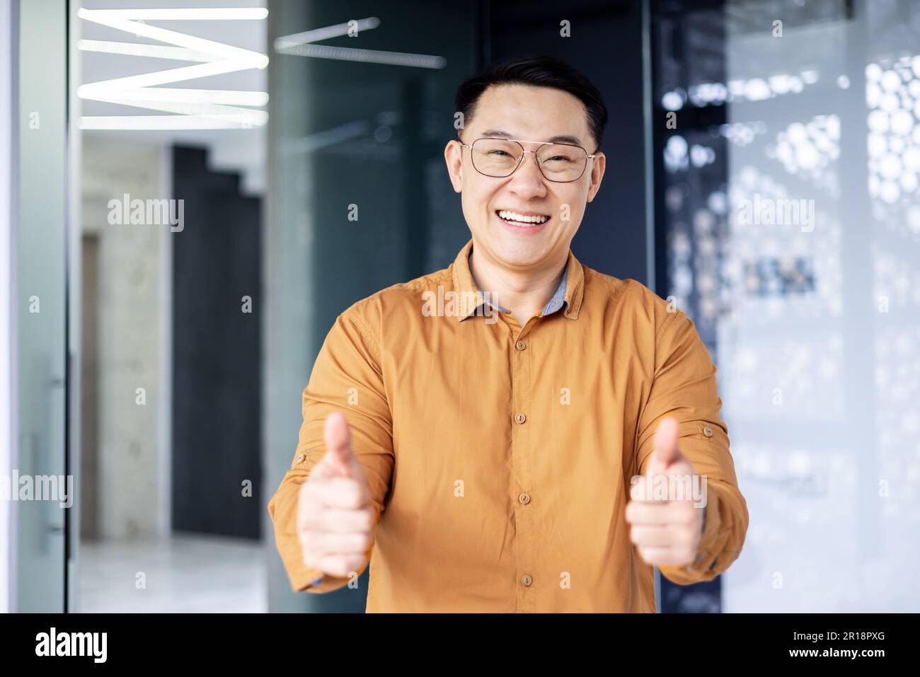 Portrait of successful asian man inside office near window, boss in ...