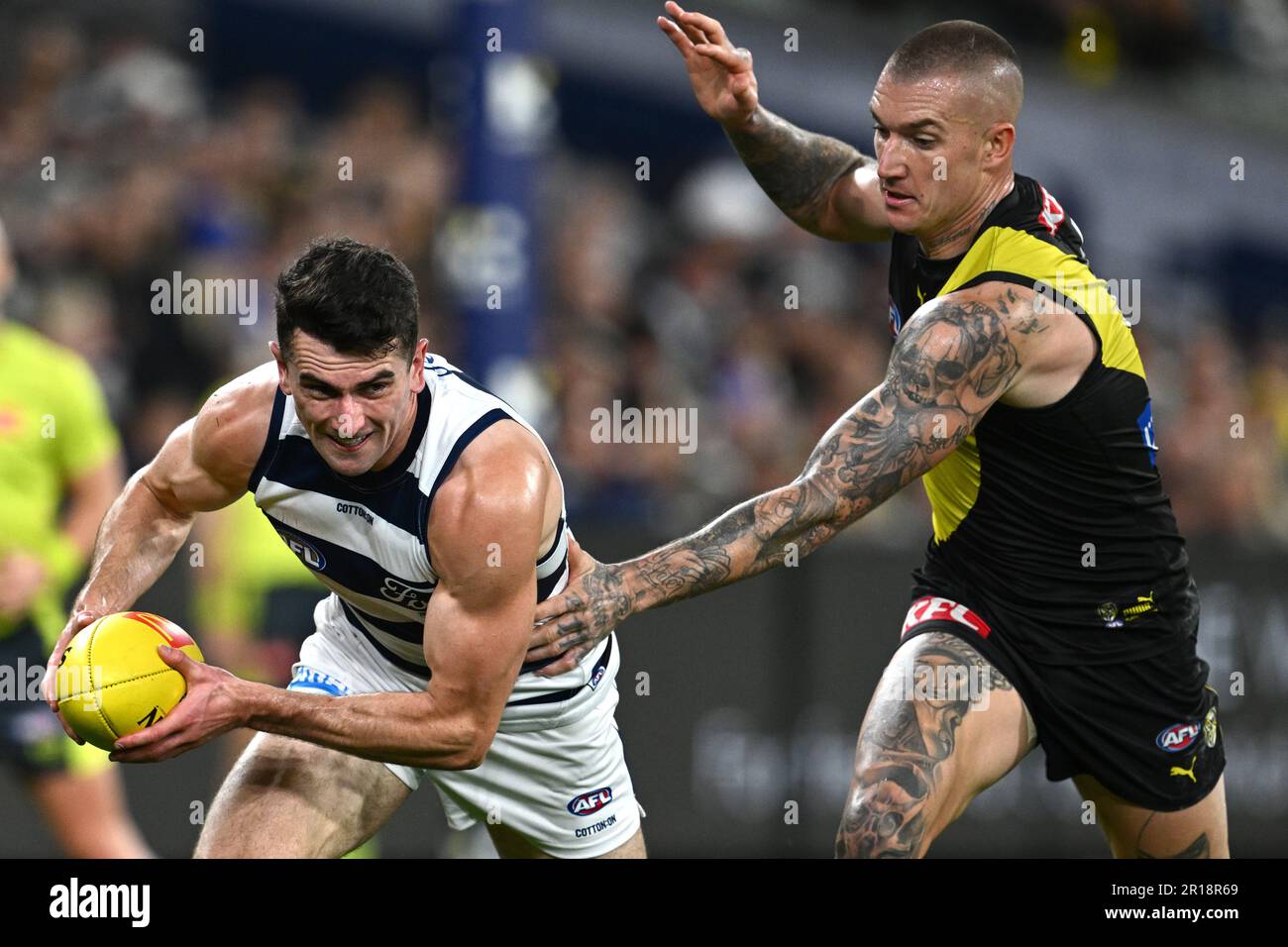 Sam Simpson of Geelong and Dustin Martin of Richmond during the AFL Round 9 match between the ...