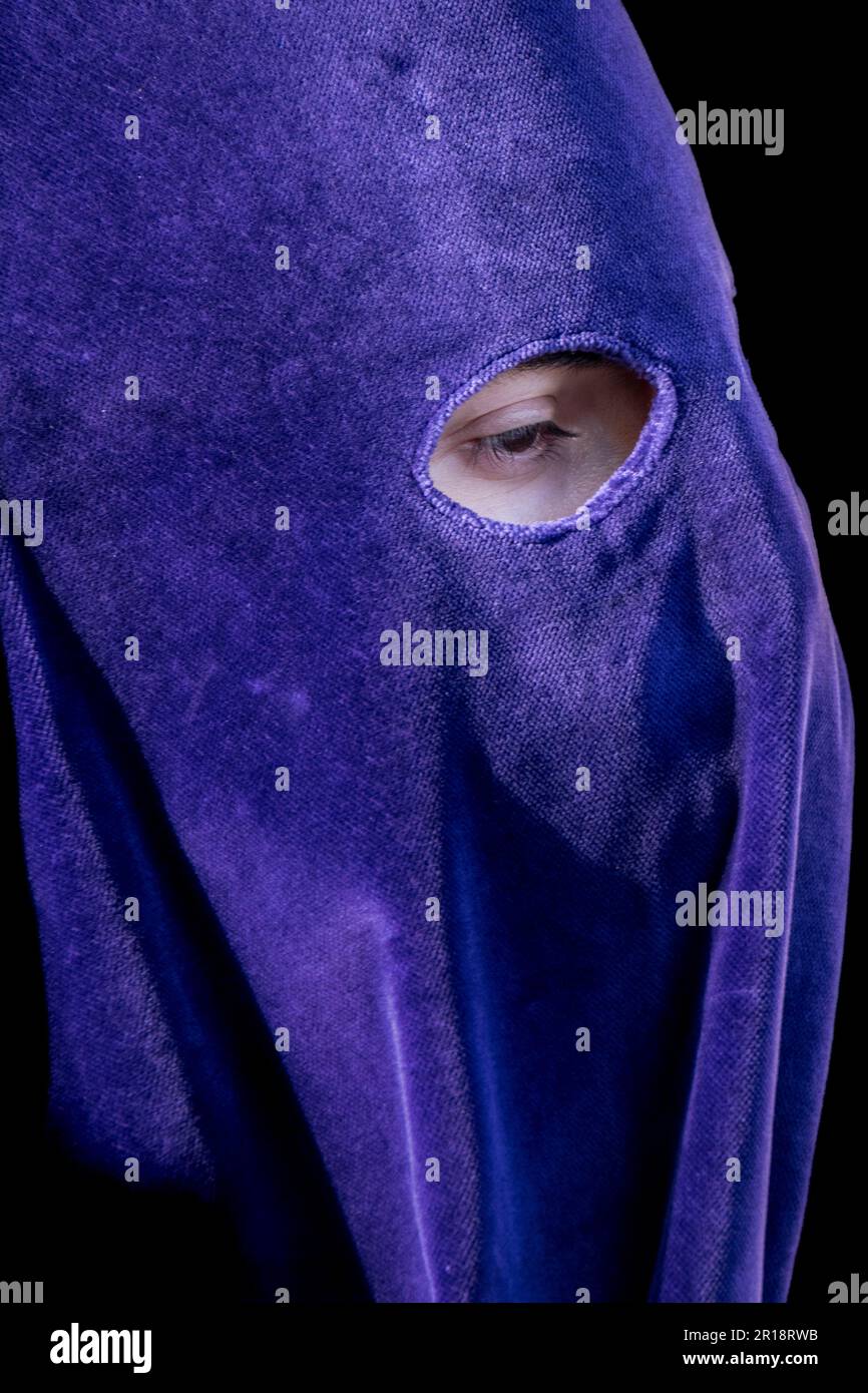 A member of the Real Hermandad de Jesús Divino Obrero wears a Capirote ...