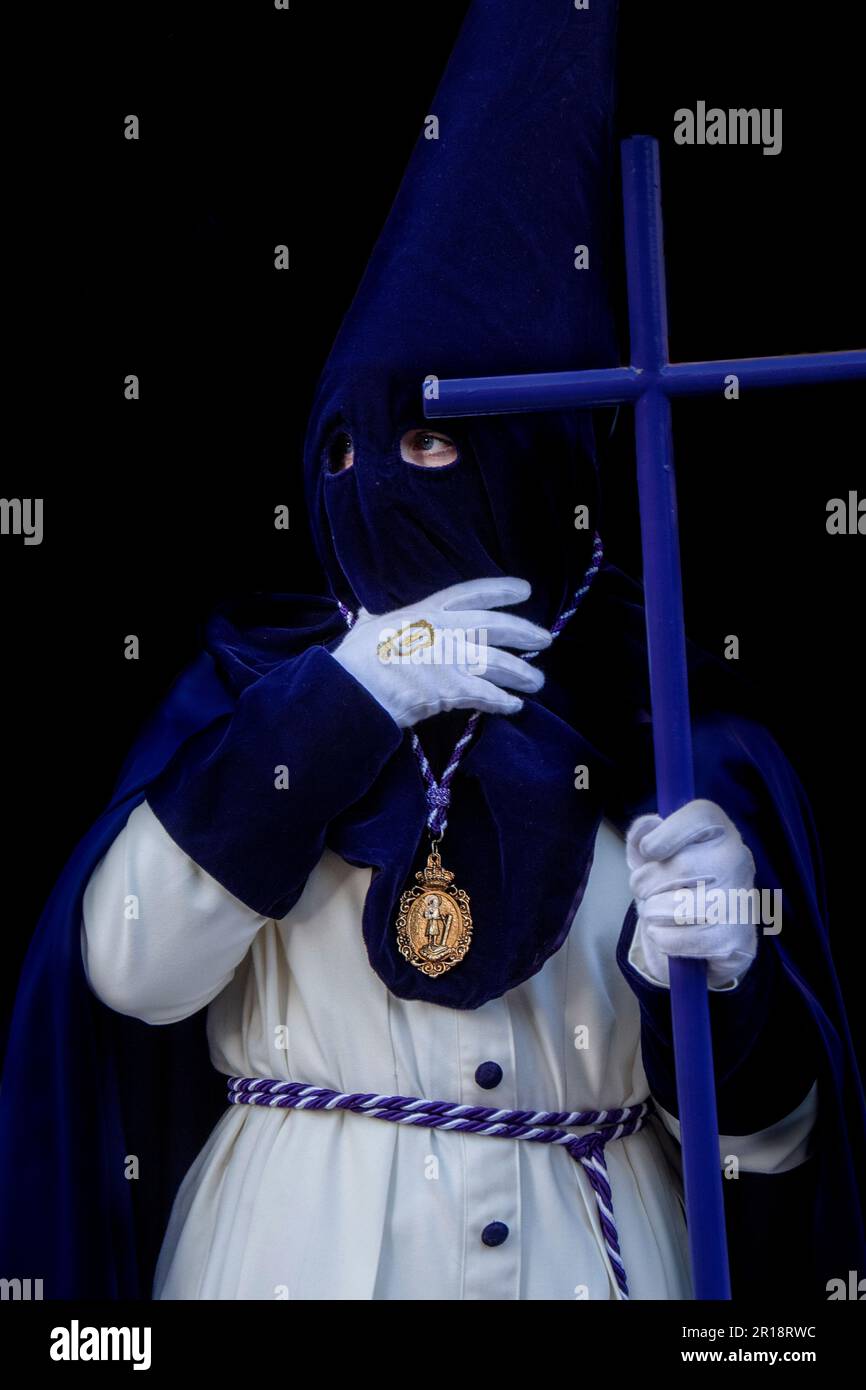 A member of the Real Hermandad de Jesús Divino Obrero wears a Capirote ...