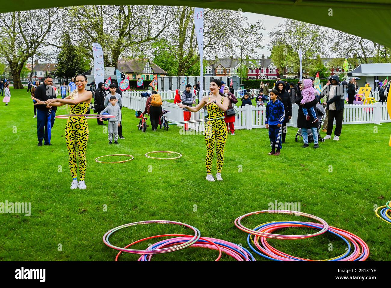 Women playing with hula hoop in festival Stock Photo - Alamy