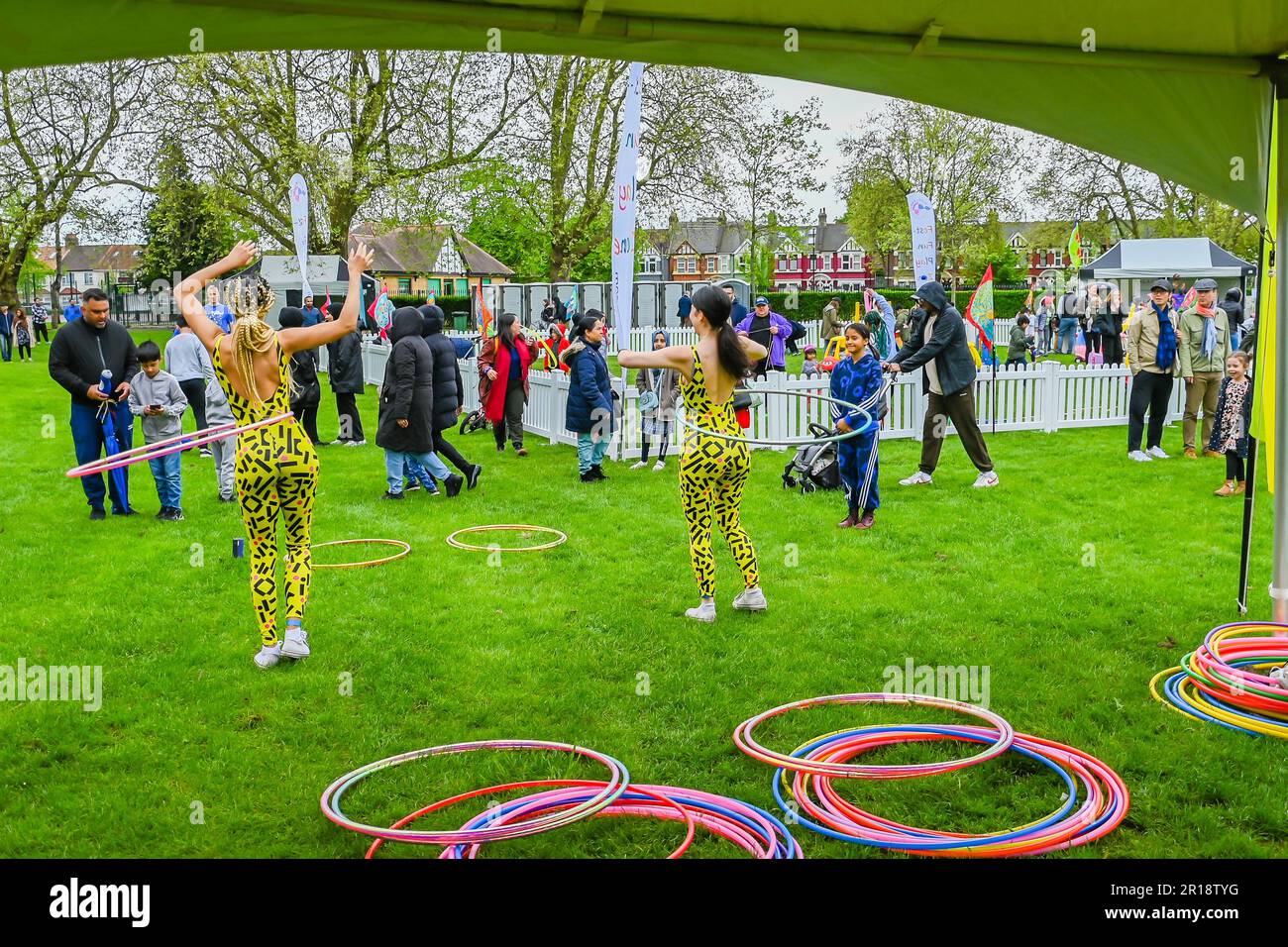 Women playing with hula hoop in festival Stock Photo - Alamy