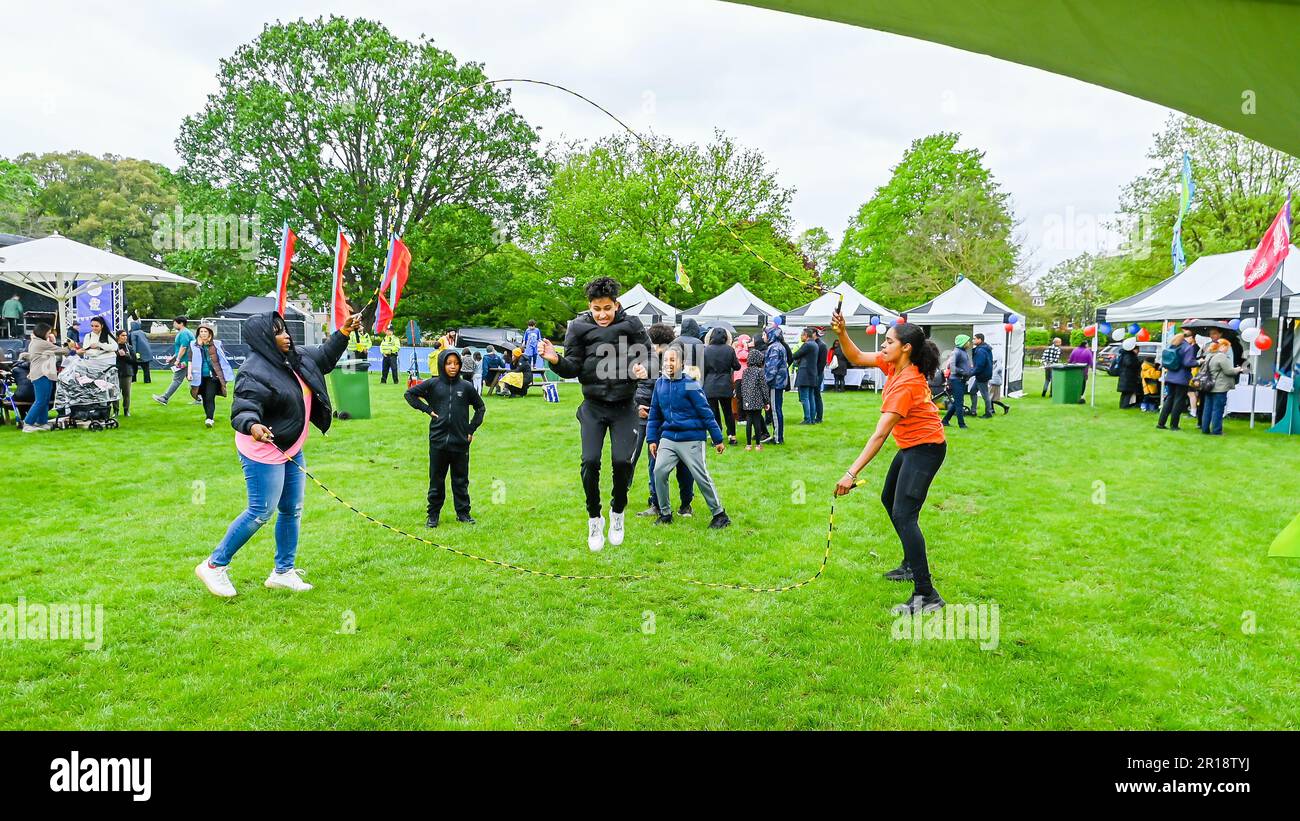 Children group happy jump rope hi-res stock photography and images - Alamy