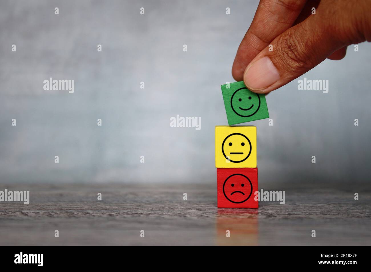 Hand choosing happy smile face. Good feedback rating and positive ...