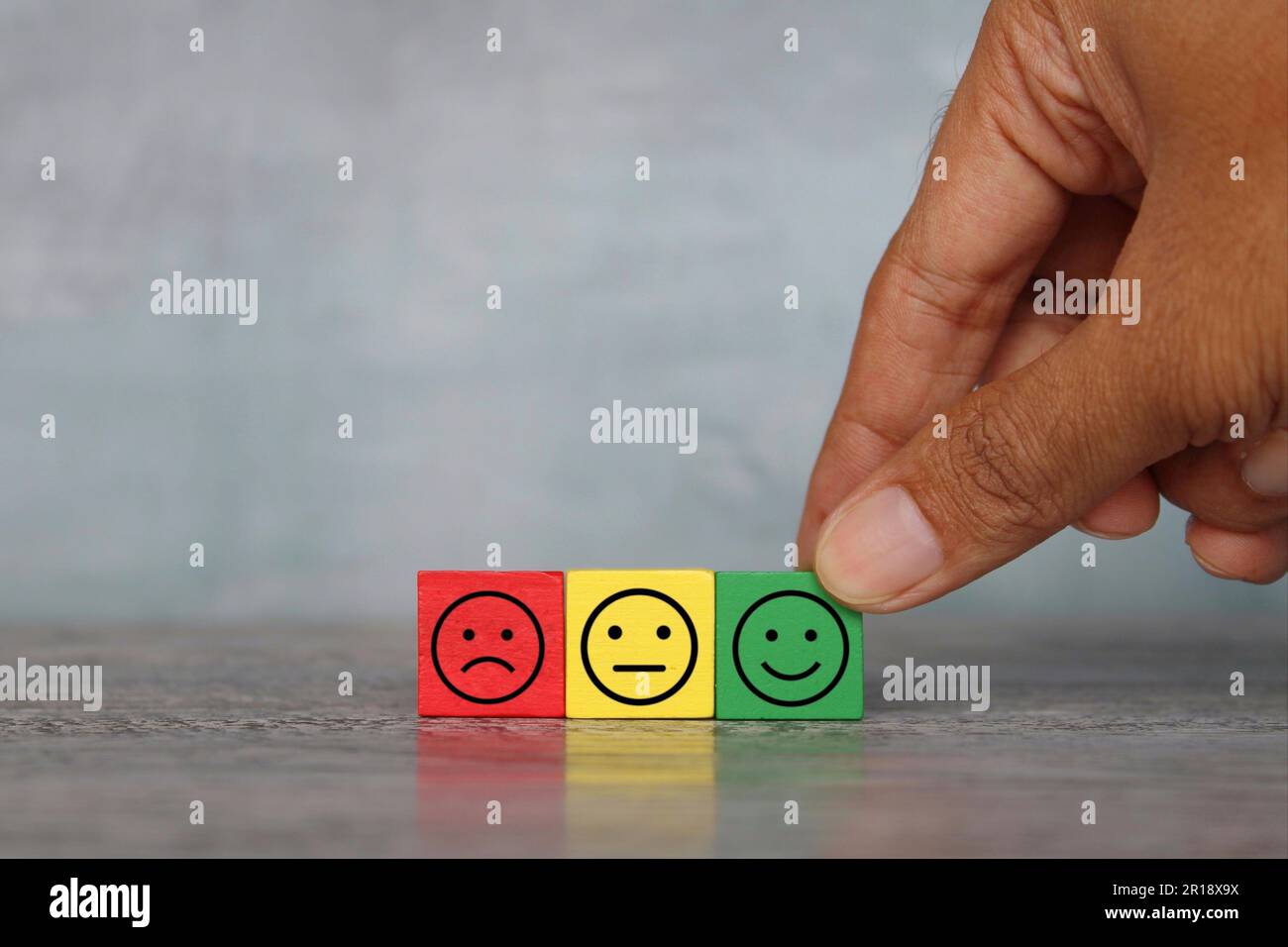 Hand choosing happy smile face. Good feedback rating and positive ...