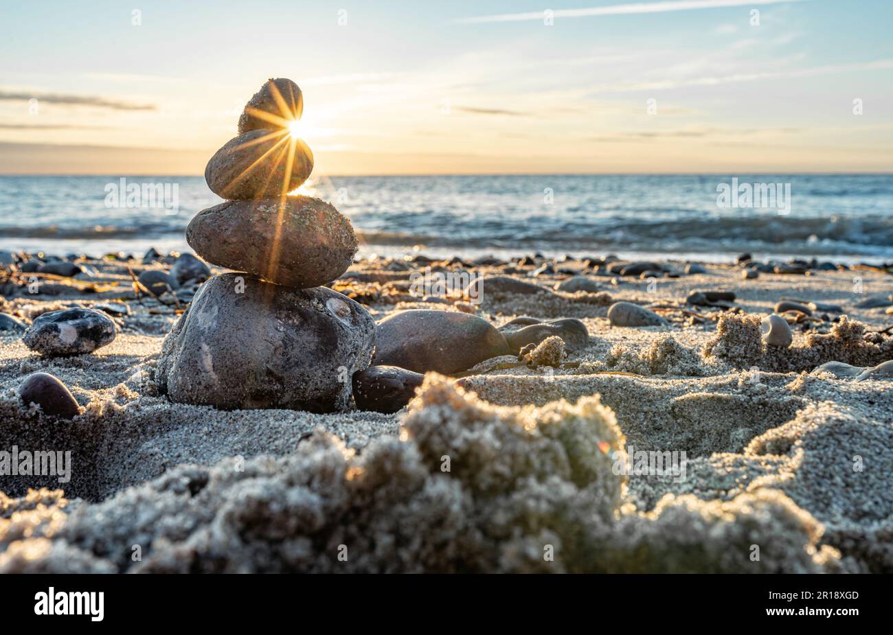 Stone pyramids on the dreamy Baltic Sea sandy beach on Rügen to the ...