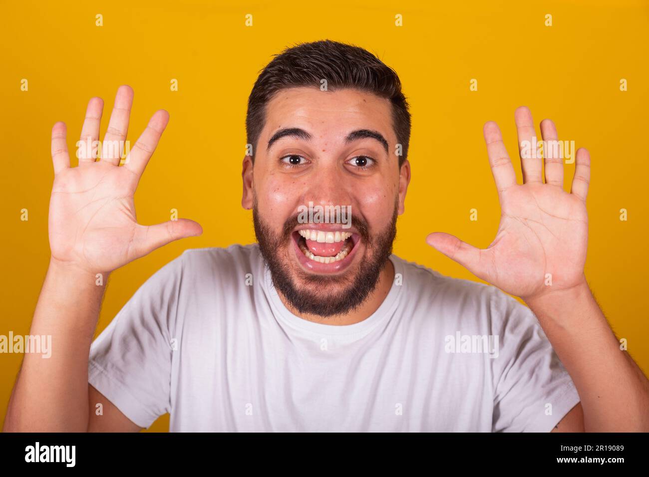 Brazilian Latin American man, with a face of astonishment, happiness ...