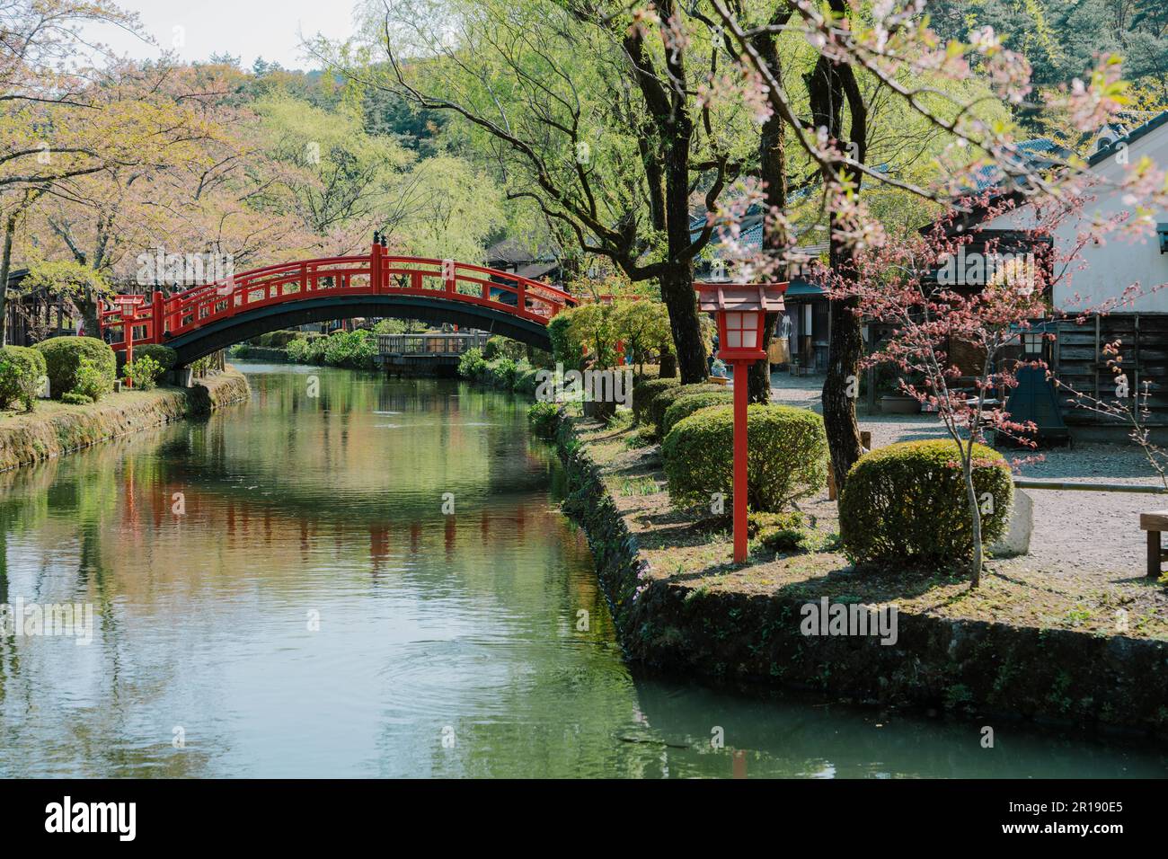Red bridge over the river in edo wonderland, japan Stock Photo - Alamy