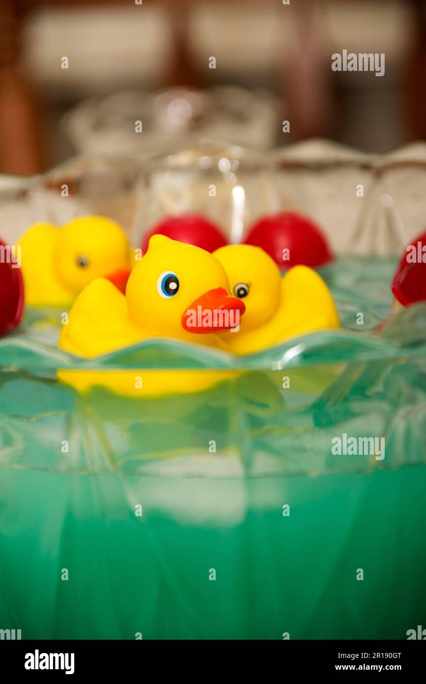 Rubber ducks floating in a bowl of punch Stock Photo - Alamy