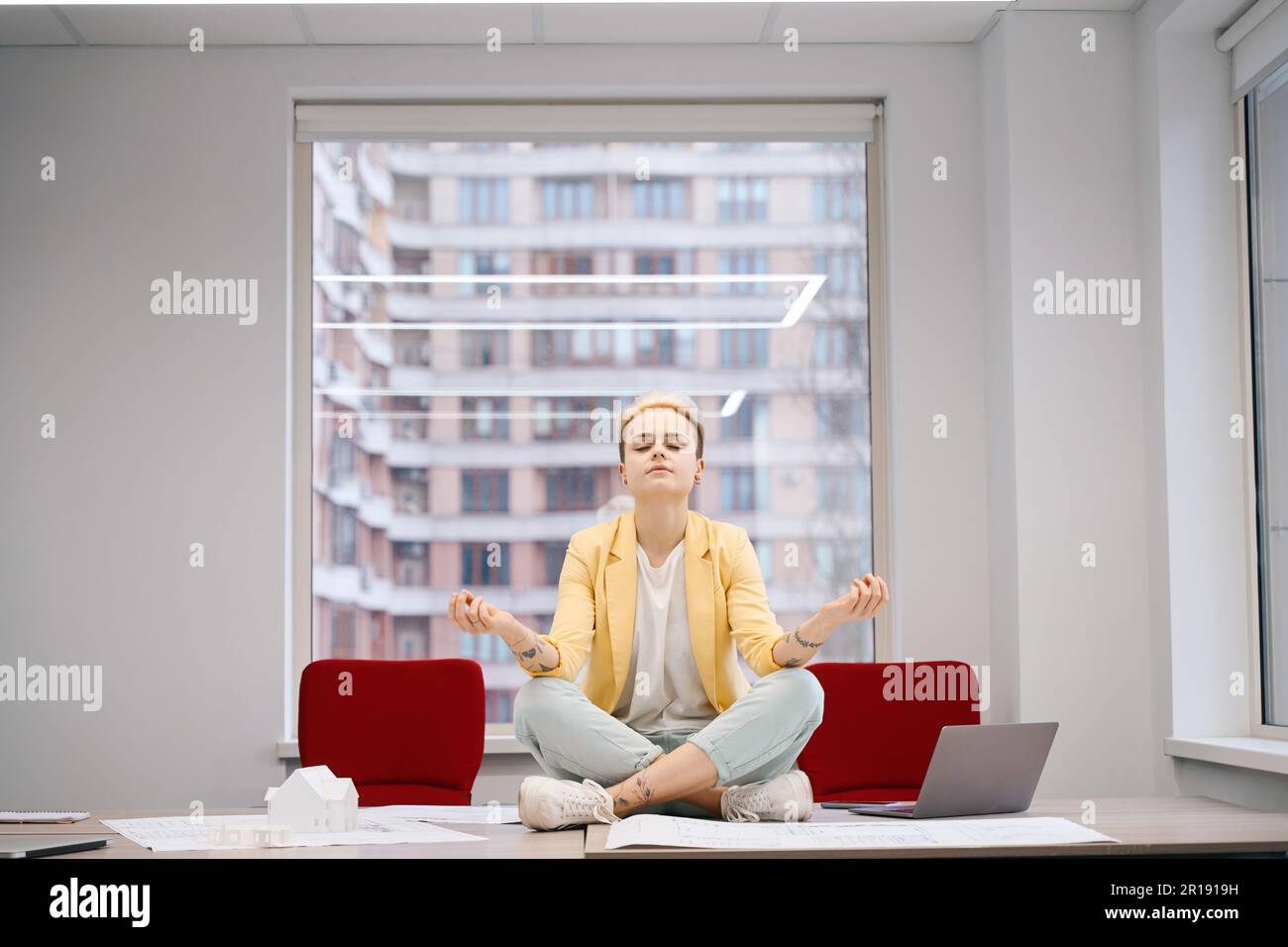 Woman meditating desk in office hi-res stock photography and images - Alamy