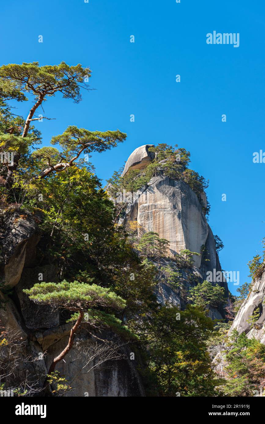 Rock Kakuenbou, a massive rocky mountain. Symbol of Mitake Shosenkyo ...