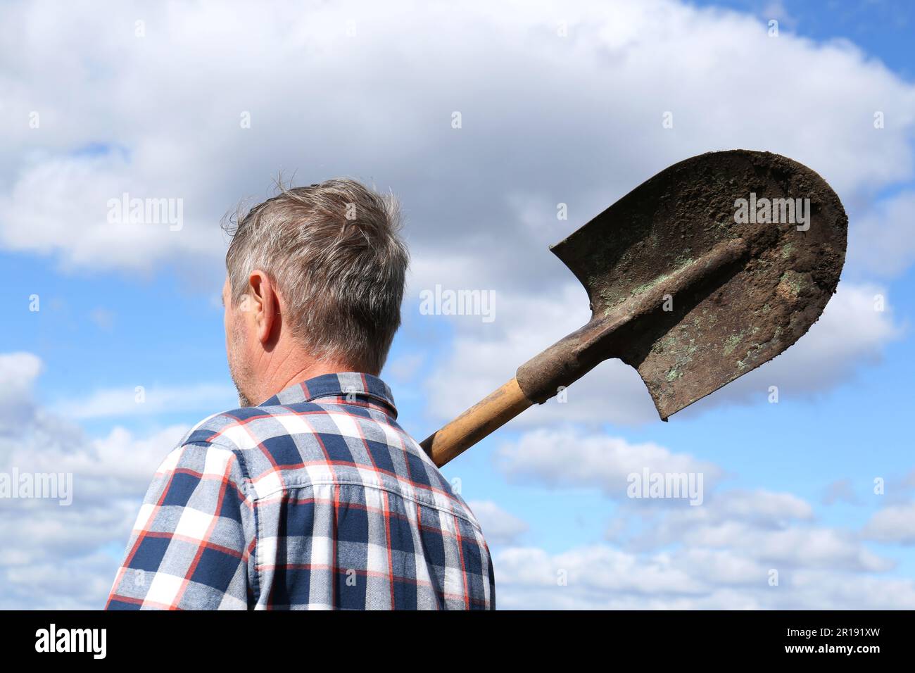 Man holding shovel hi-res stock photography and images - Alamy