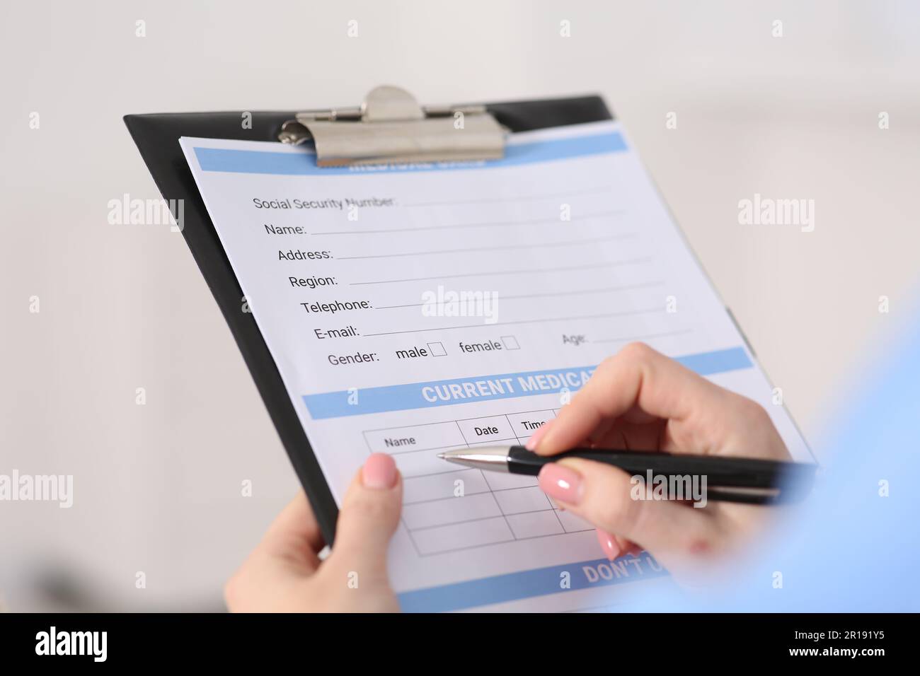 Female doctor filling medical card hi-res stock photography and images ...