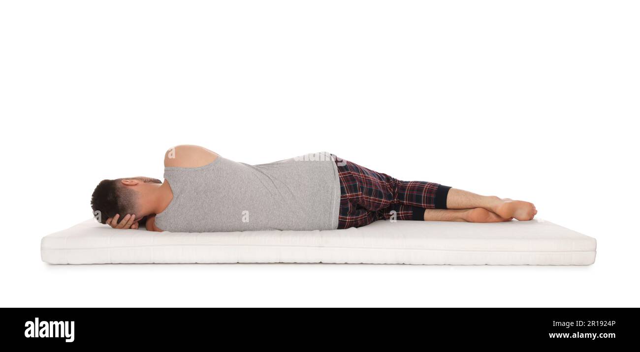 Man sleeping on soft mattress against white background, back view Stock ...