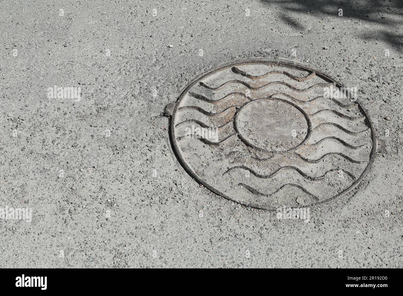 Metal sewer hatch on asphalt outdoors, space for text Stock Photo - Alamy
