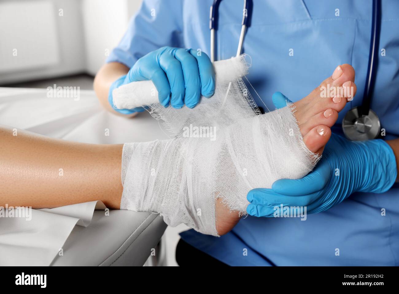 Doctor applying bandage onto patient's foot in hospital, closeup Stock ...