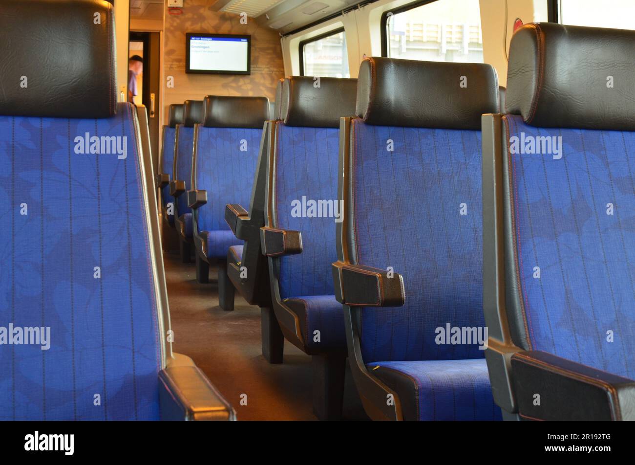 Interior of passenger train with empty seats Stock Photo - Alamy