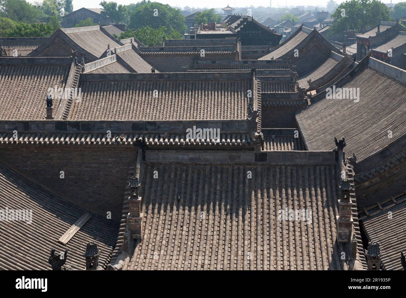 Traditional Chinese tiled pitched roofs with roof tiles in the summer ...