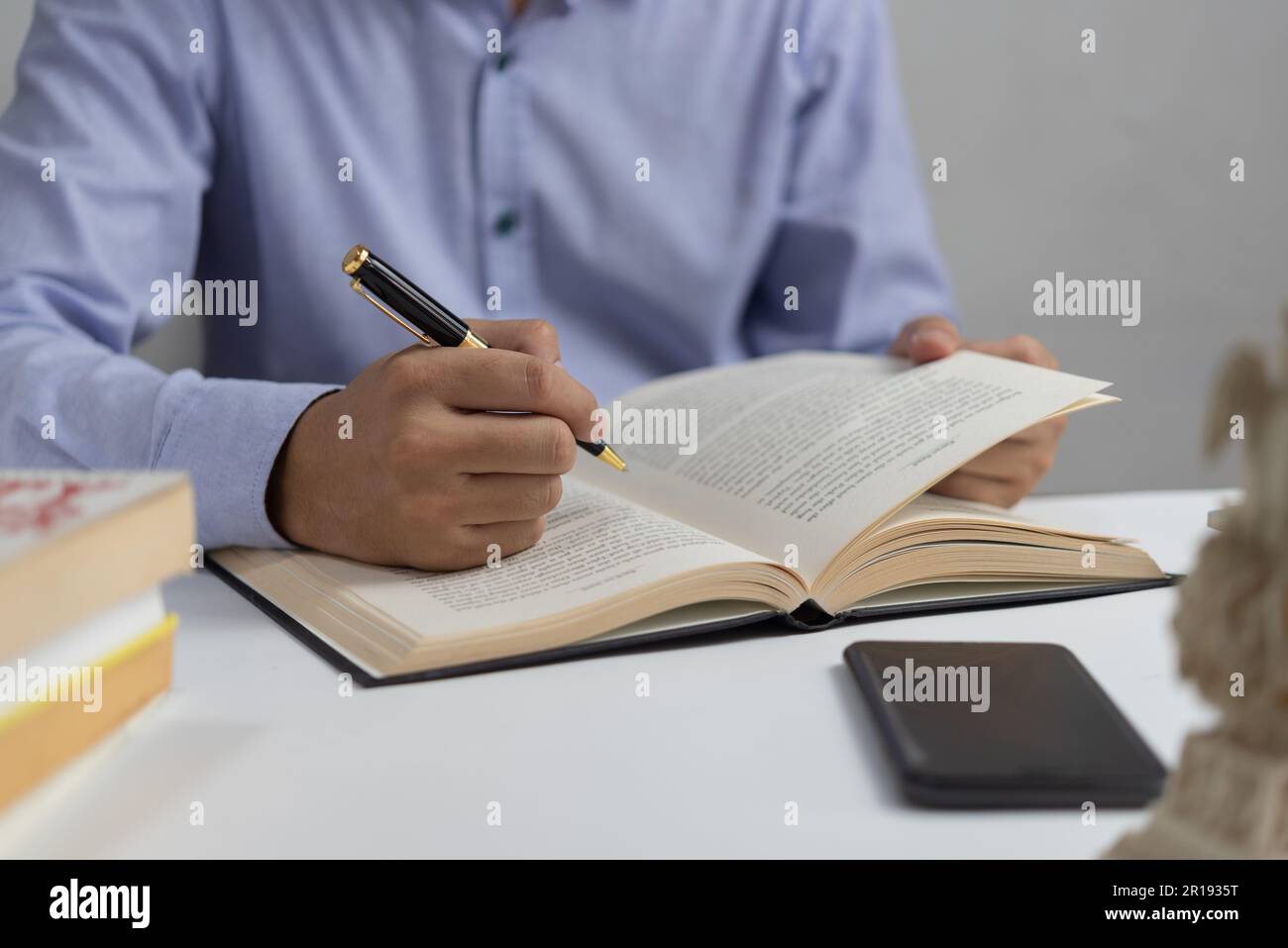 Businessperson reading and writing on book.education studying knowledge ...