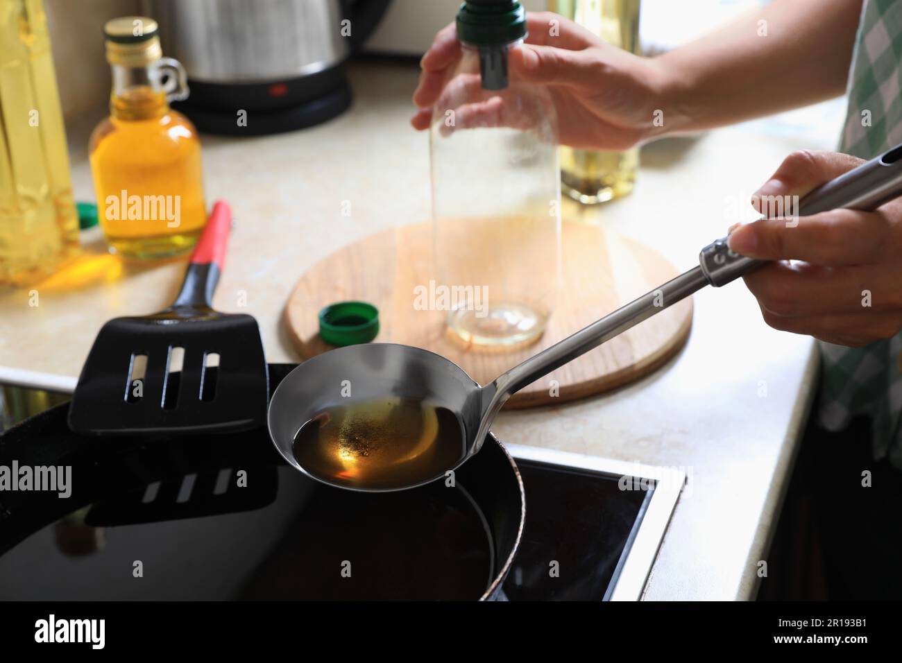Woman used cooking oil hi-res stock photography and images - Alamy