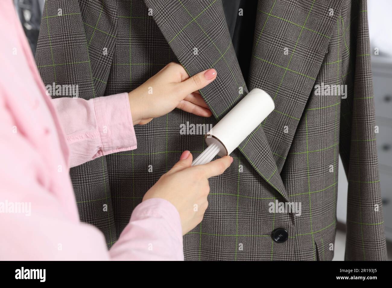 Woman cleaning lint roller hi-res stock photography and images - Alamy