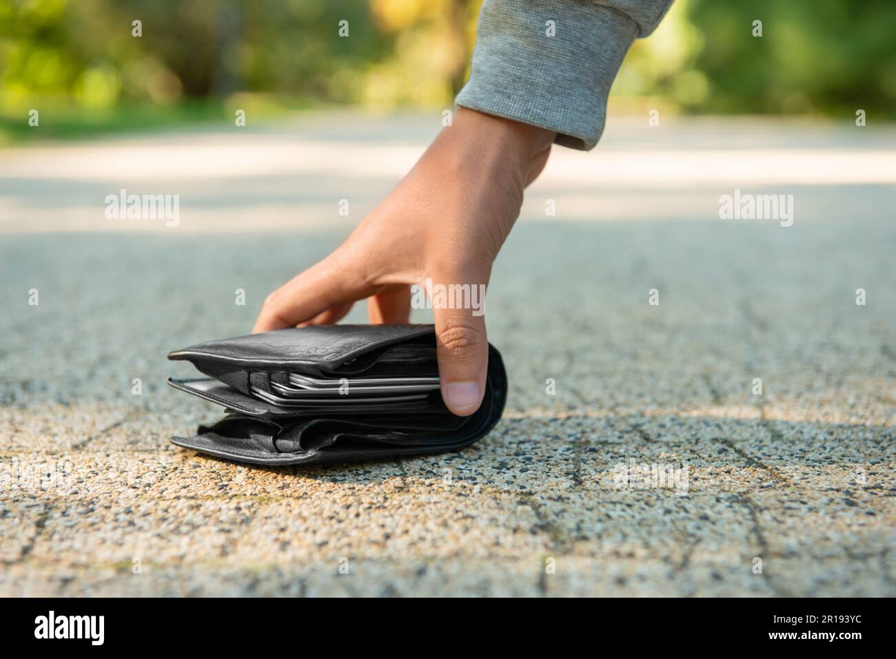 Person picking money ground hi-res stock photography and images - Alamy