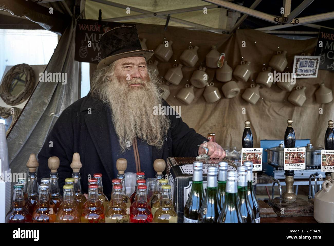 Victorian street market festival with market trader in traditional ...